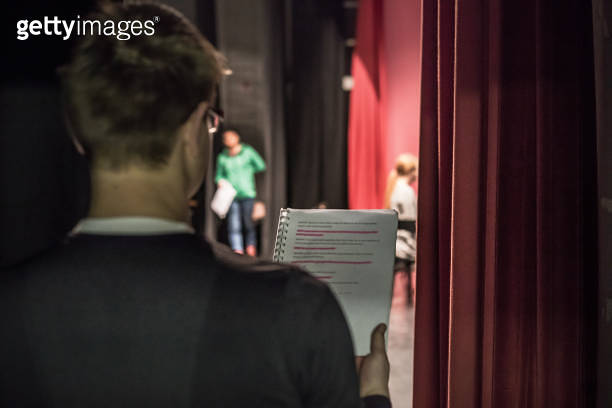 Actor Reading Script From Backstage for Assistance and Preparation ...