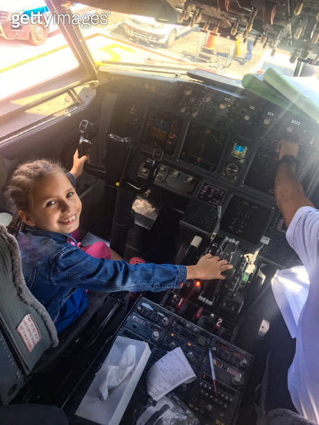Young Girl Sitting in Airplane Cockpit 이미지 (1017143840) - 게티이미지뱅크