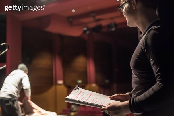 Actor Holding Script During Theatrical Rehearsal (961551032) - 게티이미지뱅크