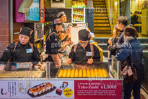 Osaka food culture female chefs cooking fast food pavement stall ...