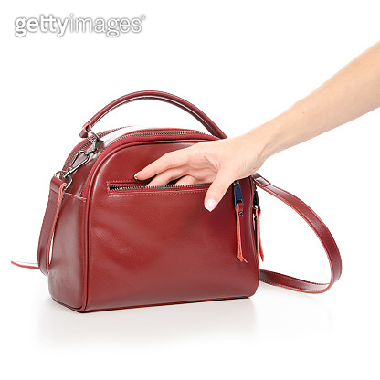Woman's female red leather bag in hand pulls out of the bag 이미지 ...