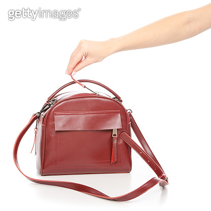 Woman's female red leather bag in hand pulls out of the bag 이미지 ...