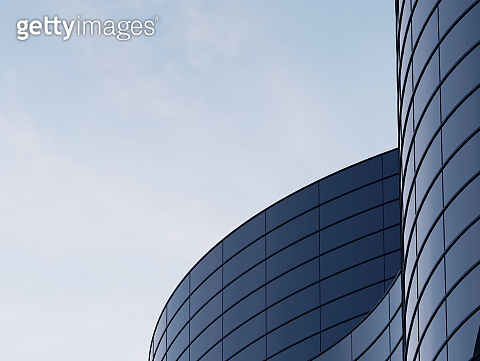 3D stimulate of high rise curve glass building and dark steel window ...