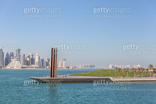 The skyline of Doha, Qatar, on a blue sky day, winter time, seen from ...