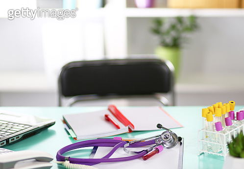 Doctor's workspace working table with patient's discharge blank paper ...
