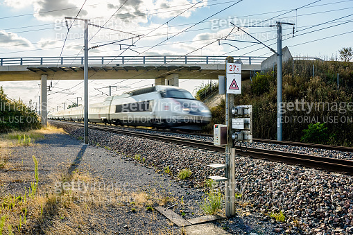 A TGV high speed train passing under a bridge on the LGV Est, the East ...