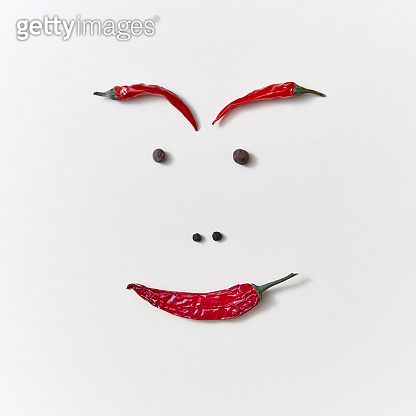 Creative pattern from red ripe chili pepper and pepper seeds in the ...