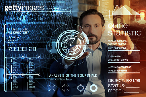 Experienced programmer looking at the screen while working with statistics 이미지 (951120618) - 게티이미지뱅크