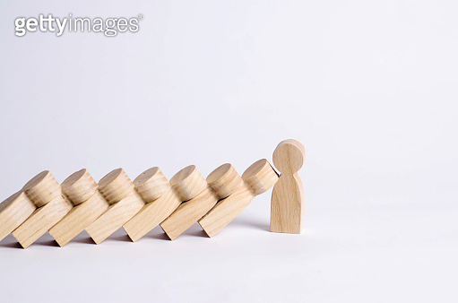 Man stops falling dominoes. Dominoes of people fall on one strong ...