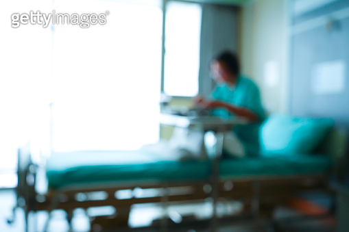 Blurred patient on bed in Hospital standard VIP room with beds and ...
