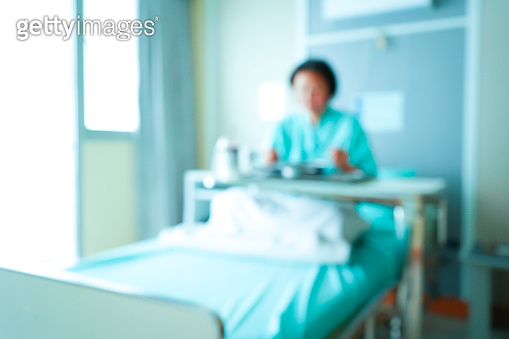 Blurred patient on bed in Hospital standard VIP room with beds and ...