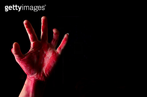 Bloody theme lone murderer: the murderer shows bloody hands and ...