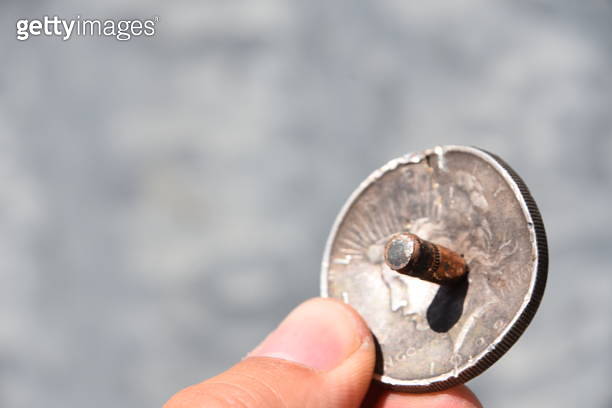 Life saving coin , coin that stopped a bullet 이미지 (923597720) - 게티이미지뱅크