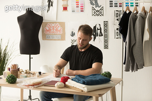 Serious male designer creating new ethnic clothing line 이미지 (1044943288 ...
