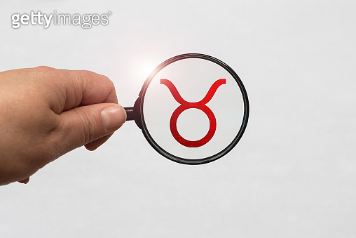 Illustration of a magnifying glass focusing on the Red Taurus Zodiac ...