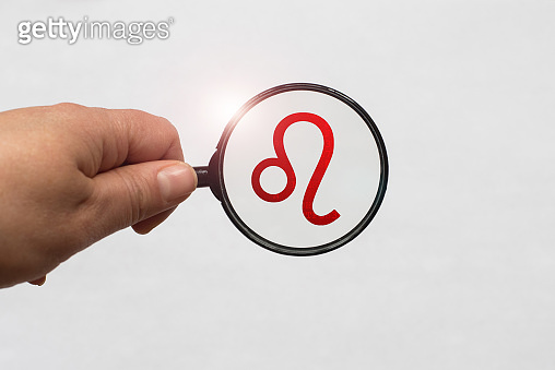 Illustration of a magnifying glass focusing on the Red Leo Zodiac Sign ...
