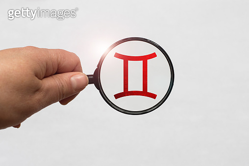 Illustration of a magnifying glass focusing on the Red Gemini Zodiac ...