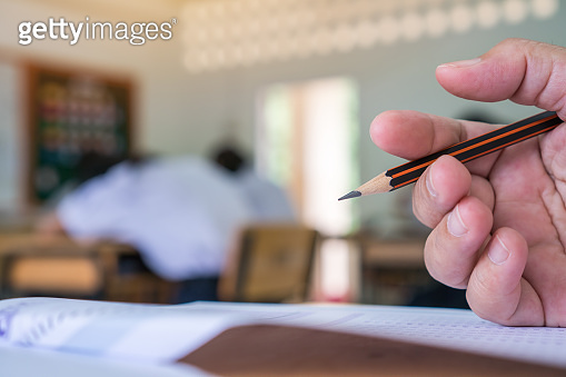 Students hands taking exams, writing examination room with holding ...