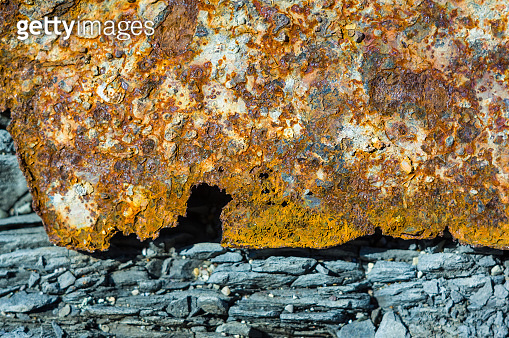 Very rusty metal on a gray cracked rock 이미지 (1057607136) - 게티이미지뱅크