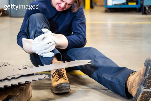 An industrial safety topic. A worker tripping over a poorly placed ...