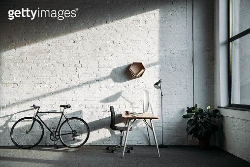 bicycle and working table with computer in office 이미지 (925269704) - 게티이미지뱅크