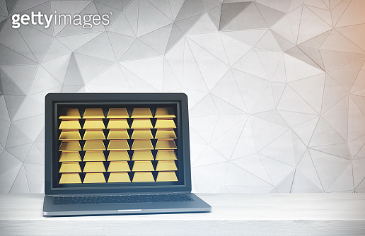 Laptop with gold bullions, polygons (938546286) - 게티이미지뱅크