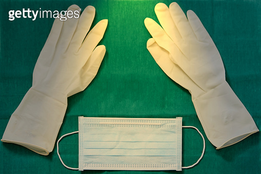Disposible sterile rubber,one time used Gloves with surgeon mask on ...