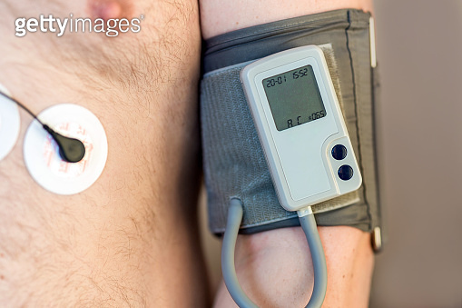 Holter monitor device and daily blood pressure recorder on human male ...