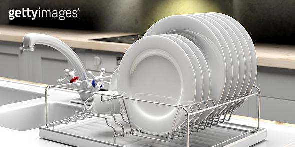 Dish drying rack with white plates on a white kitchen counter. 3d ...