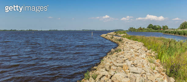 Panorama of a small dike at the Schildmeer lake in Groningen, The ...