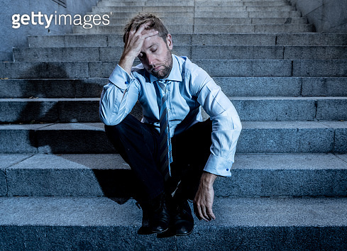 Young fired business man lost in depression crying abandoned sitting on ...