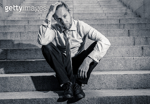 Young fired business man lost in depression crying abandoned sitting on ...