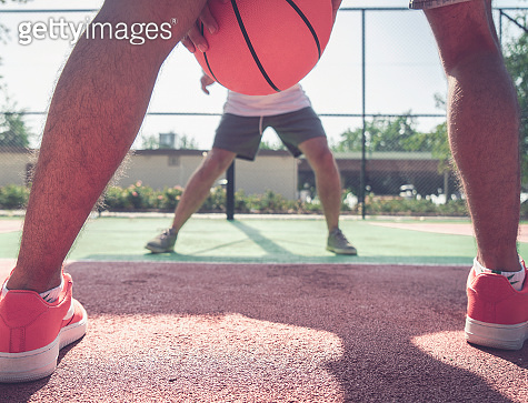 Basketball Players Feet and hand on ball, court ground - Stock image ...