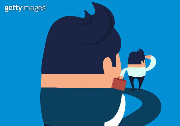 Businessman standing on the shoulder of the giant looking into the ...