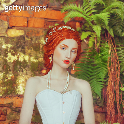 Young victorian princess with hairstyle in castle. Fabulous rococo ...