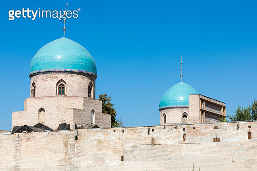 The facade of the Norbut-biy Madrasah in Kokand, Uzbekistan ...