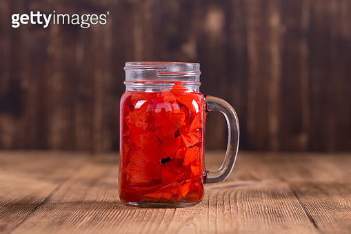 Red poppy flower tea drink in glass mug on wooden background. Concept ...