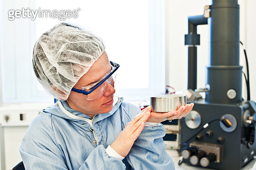 Research And Development: Female Scientist Examines A Specimen By The ...