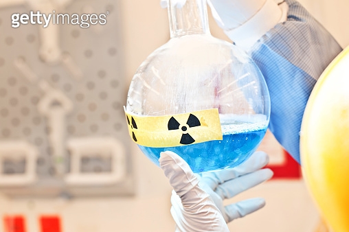 Radiation Research And Development: Scientist Examines Blue Radioactive ...