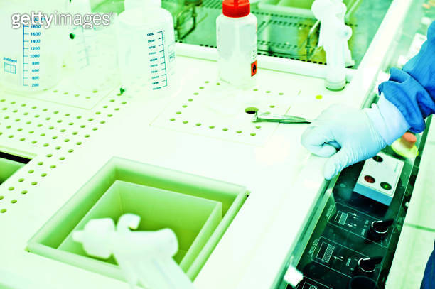 Scientist Waiting While Rinsing Semiconductor Wafer After Chemically ...