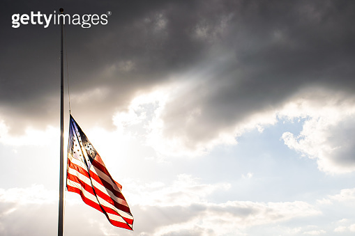 Perfect American Flag lowered to Half-Mast waving in the wind fully ...