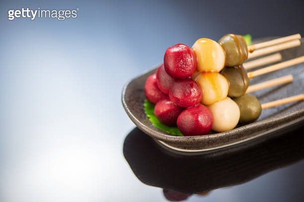 Japanese Dango dessert with 3 different color in pink(red), white, and ...