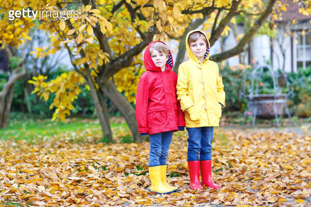 Two little best friends and kids boys autumn park in colorful clothes ...