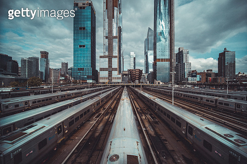New York subway trains parked with building under construction in the ...
