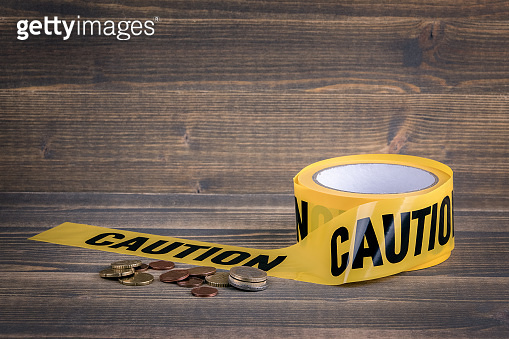 insurance business, financial success. yellow caution tape on a wooden ...