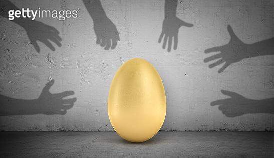 3d rendering of a large golden egg stands on a grey concrete background ...