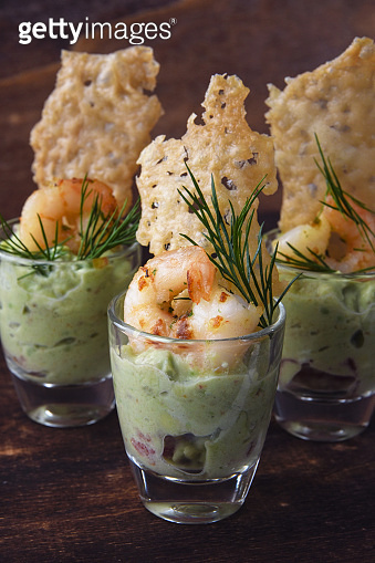 appetizer party snacks in glasses, avocado cream guacamole with tiger ...