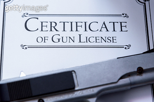 Handgun laying on a Gun / Firearms License Certificate 이미지 (978450582 ...