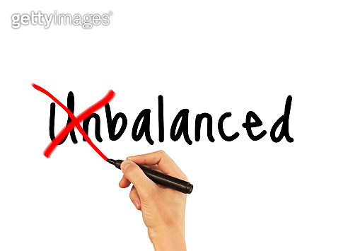 Unbalanced - male hand writing text on white background 이미지 (1068635048 ...