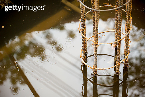 steel lines builded prepare to concrete pole. base core of building ...